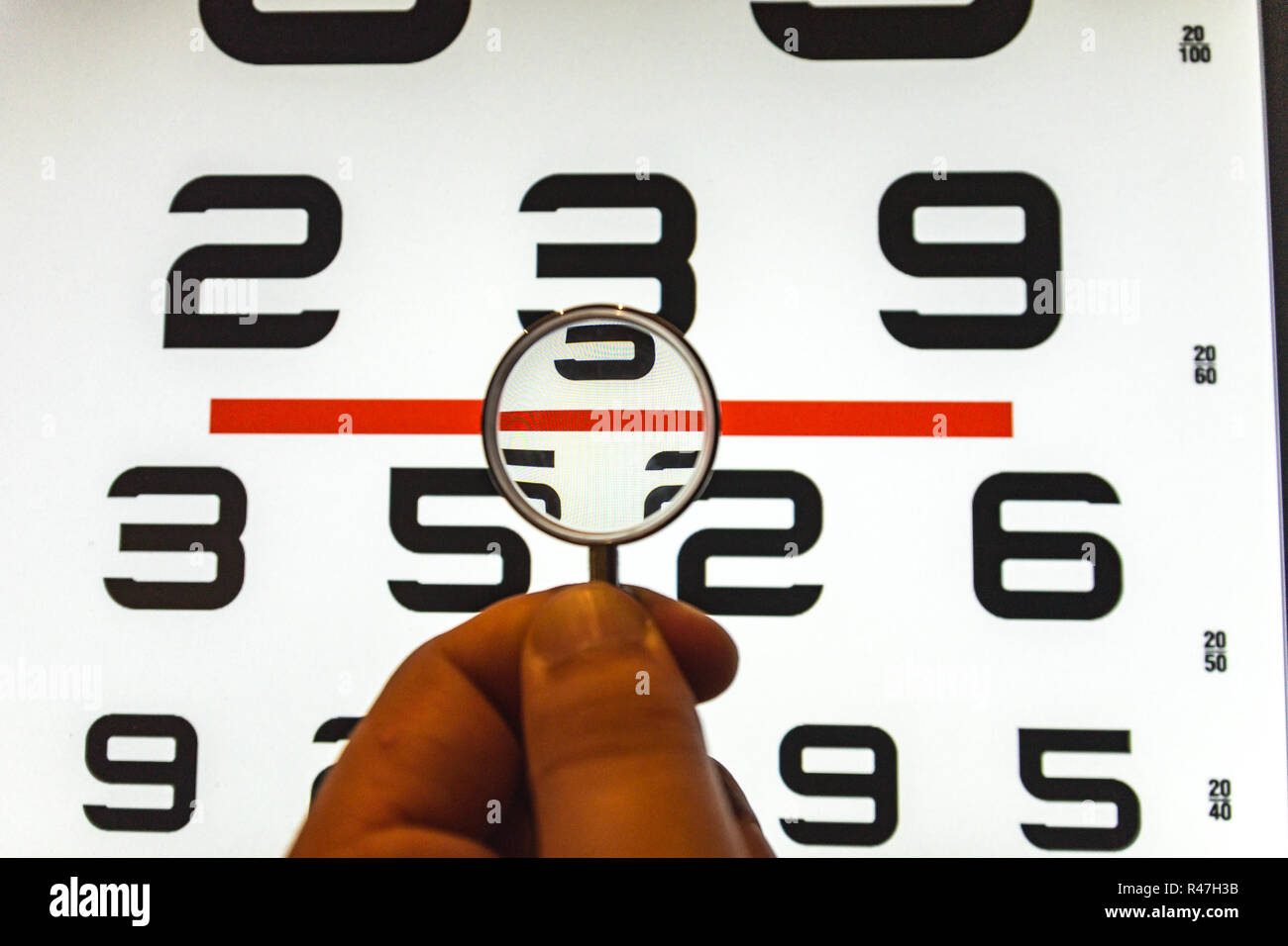 negative concave ophthalmic lens on a blurred background of number eye ...