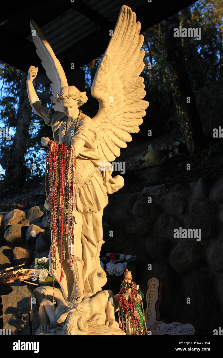 Angels holding armfuls of rosaries left as mementos of private requests ...