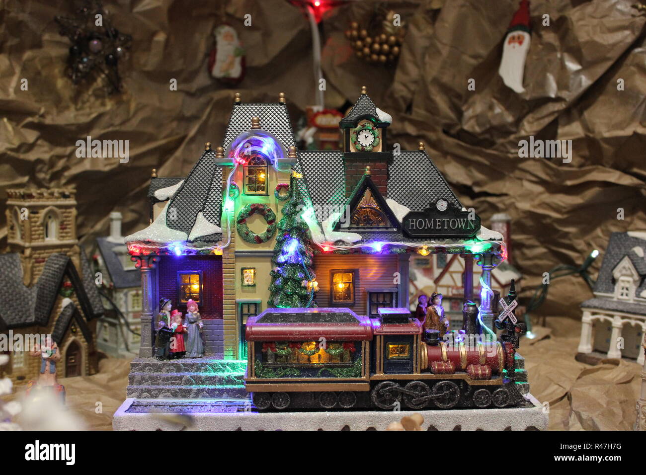 Miniature vintage train station displayed as Christmas holiday ...