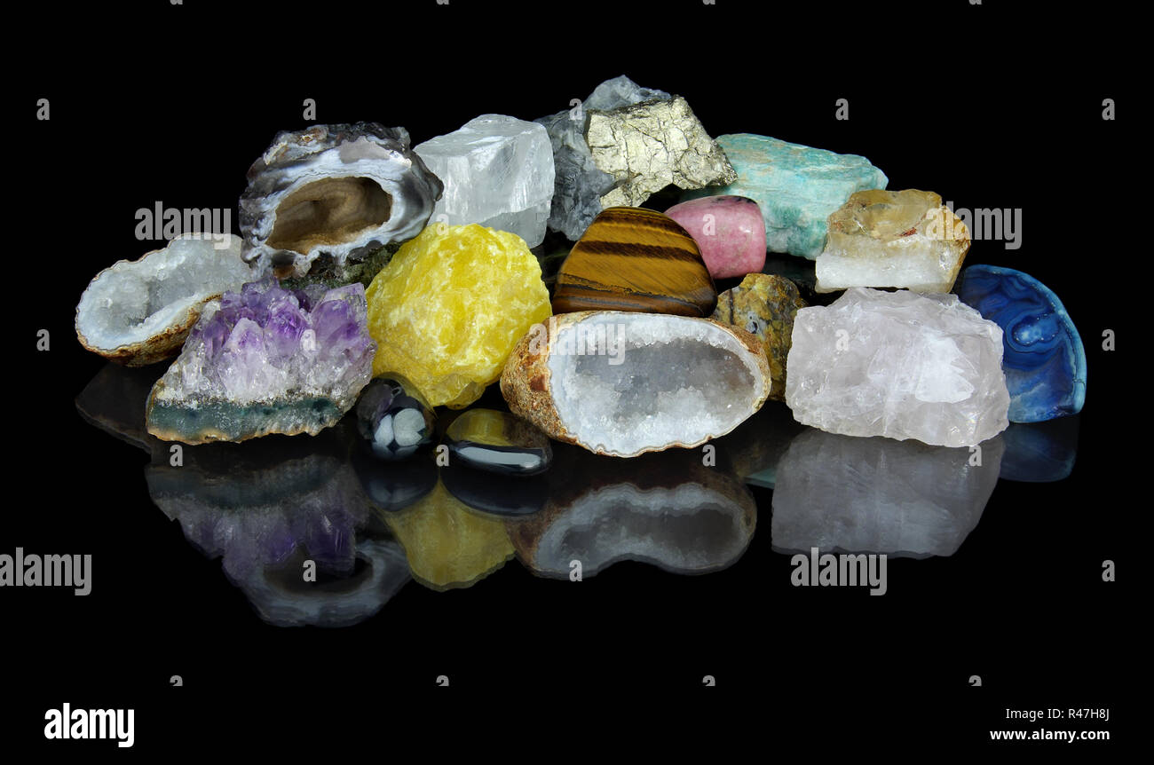 Set of different minerals isolated on a black background with ...