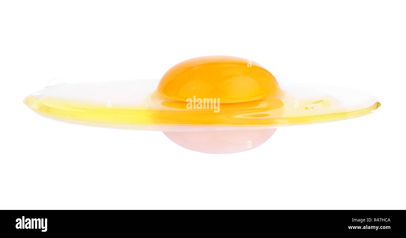 A raw egg without the shell on reflective surface, isolated on a white ...