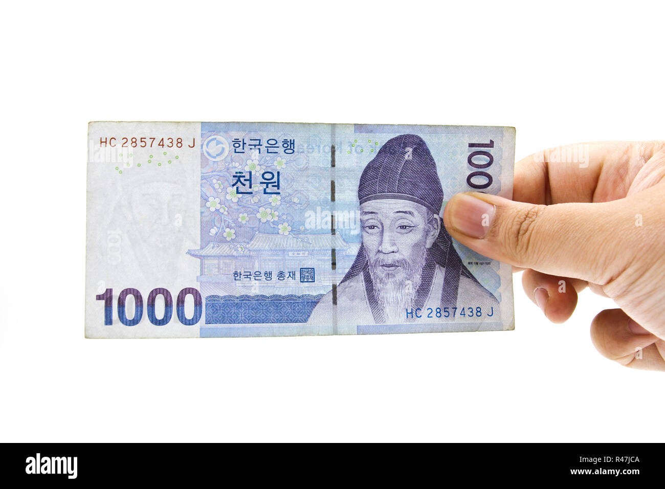 Korean Won currency bills in hand isolated on white background Stock ...