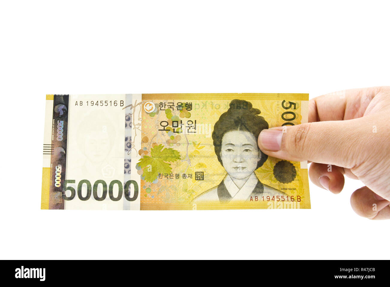 Korean Won currency bills in hand isolated on white background Stock ...