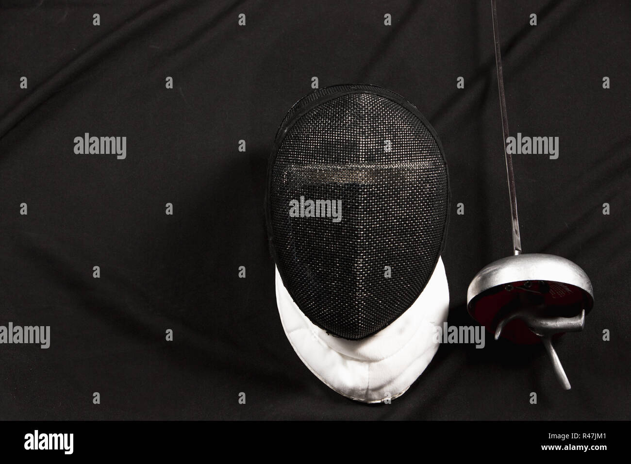 The fencing mask and rapier Stock Photo - Alamy