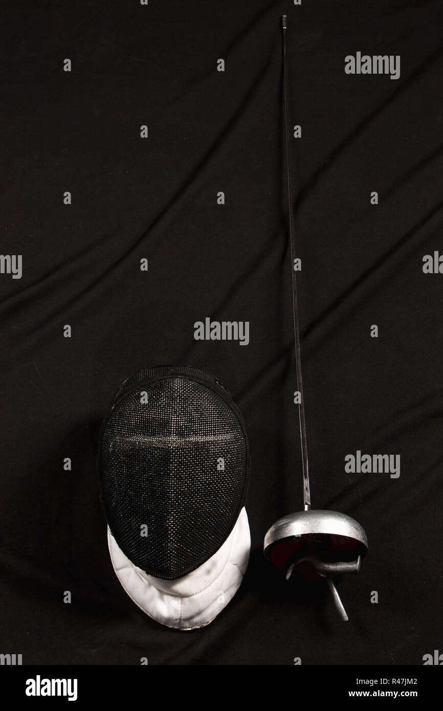 The fencing mask and rapier Stock Photo - Alamy