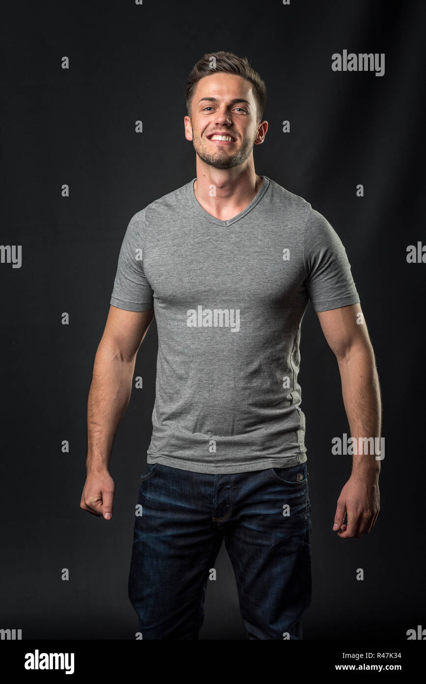 smiling dream man in jeans Stock Photo - Alamy