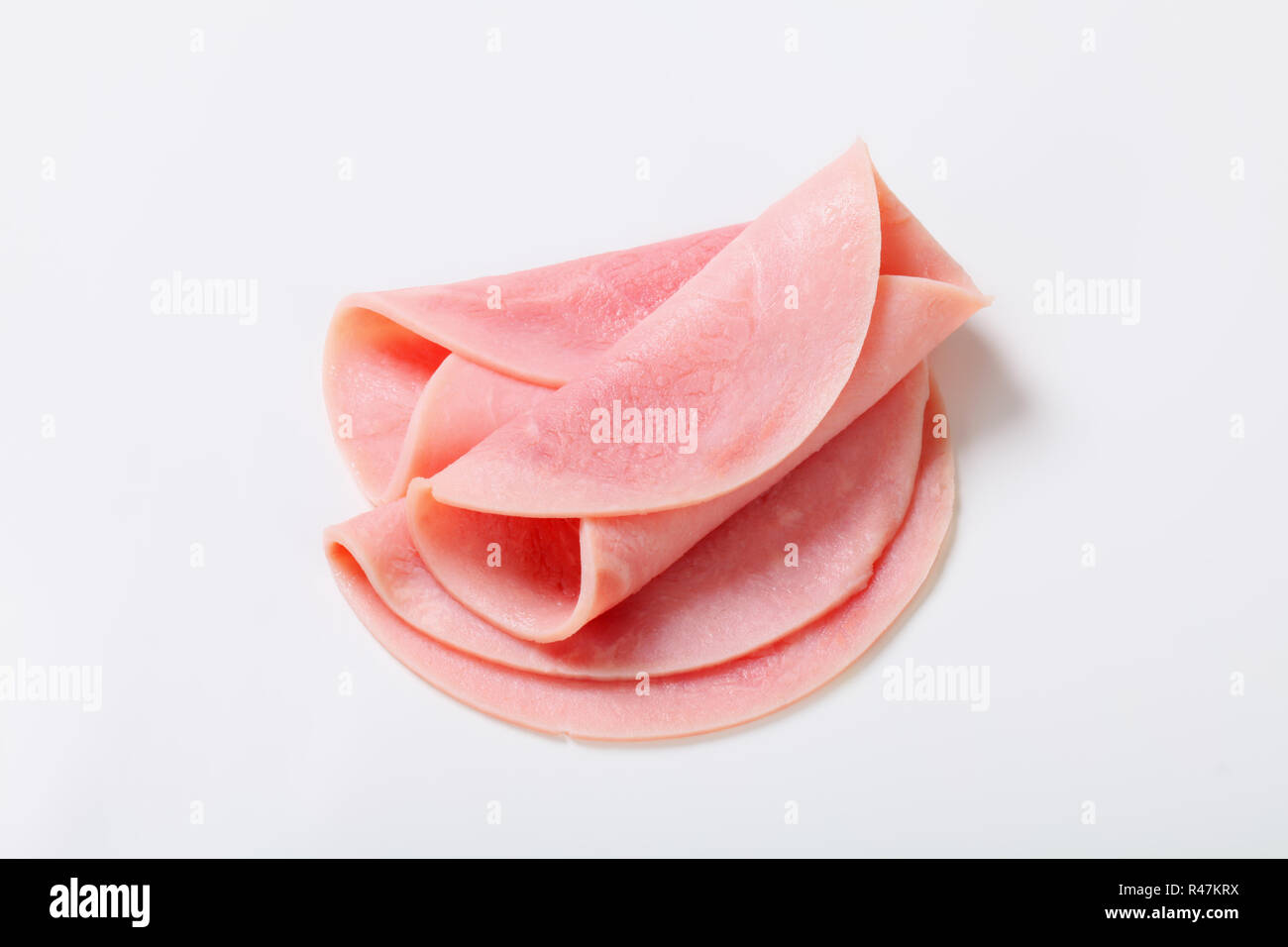 Thin slices of ham Stock Photo - Alamy