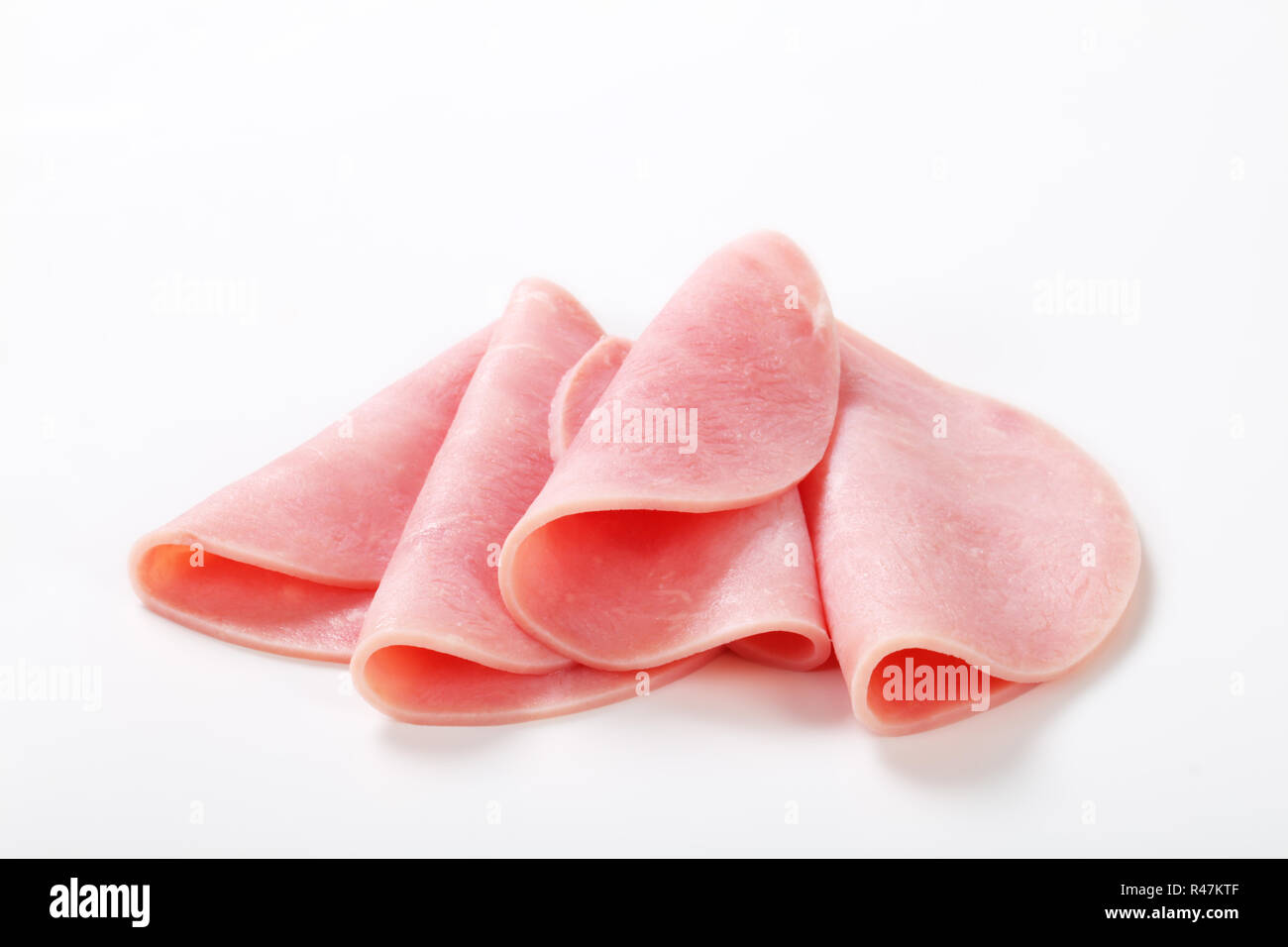 Thin slices of ham Stock Photo - Alamy