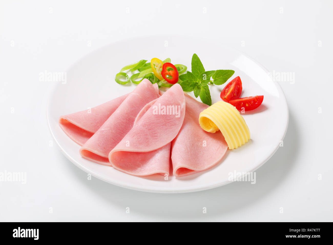 Thin slices of ham Stock Photo - Alamy