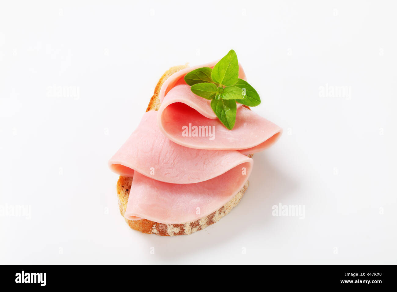 Slice of bread with ham Stock Photo - Alamy