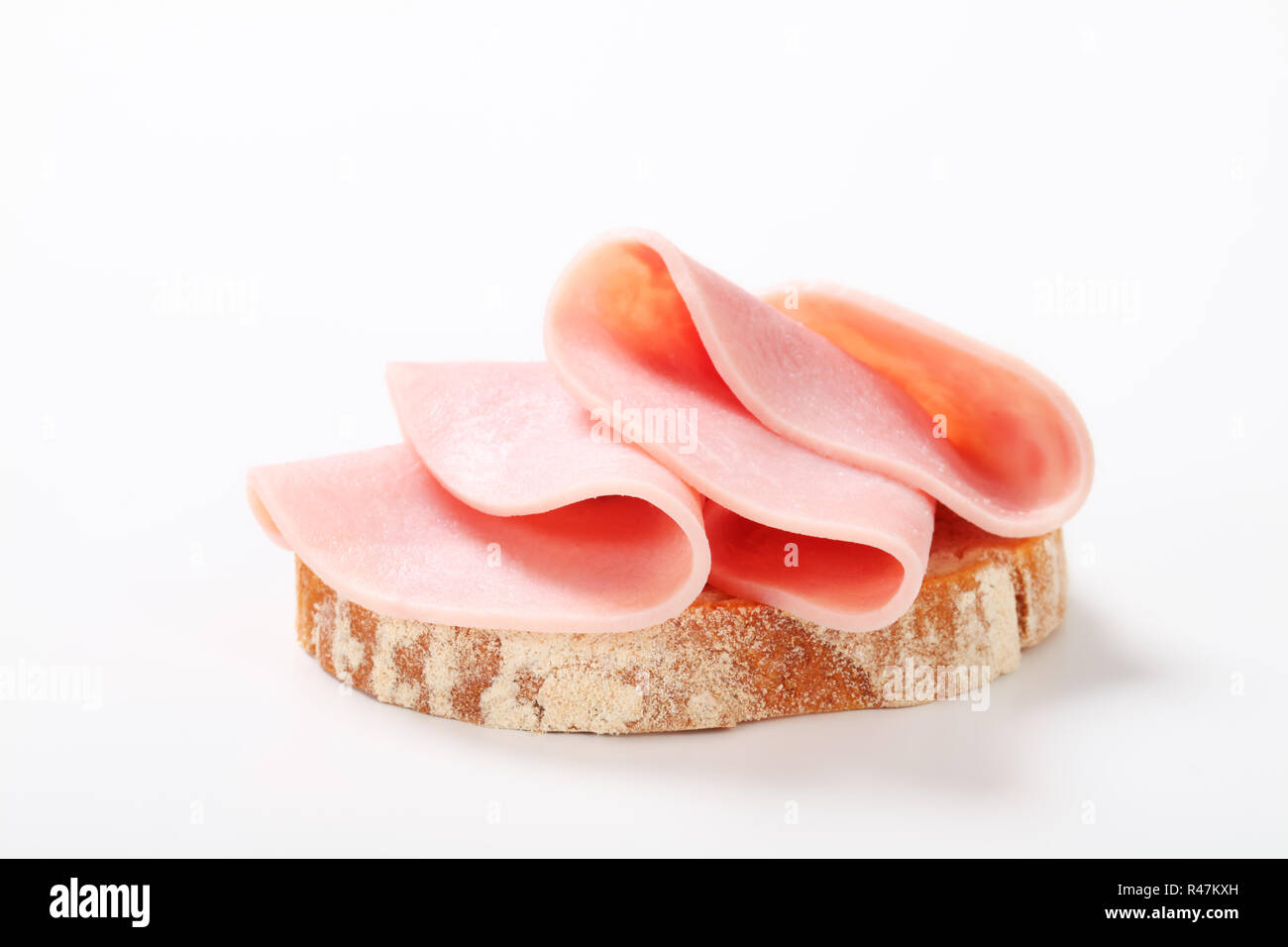 Slice of bread with ham Stock Photo - Alamy