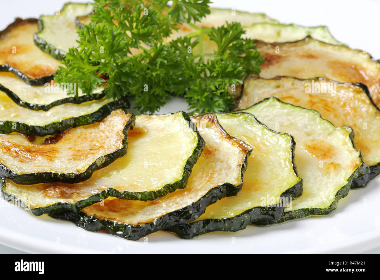 Roasted zucchini slices Stock Photo - Alamy