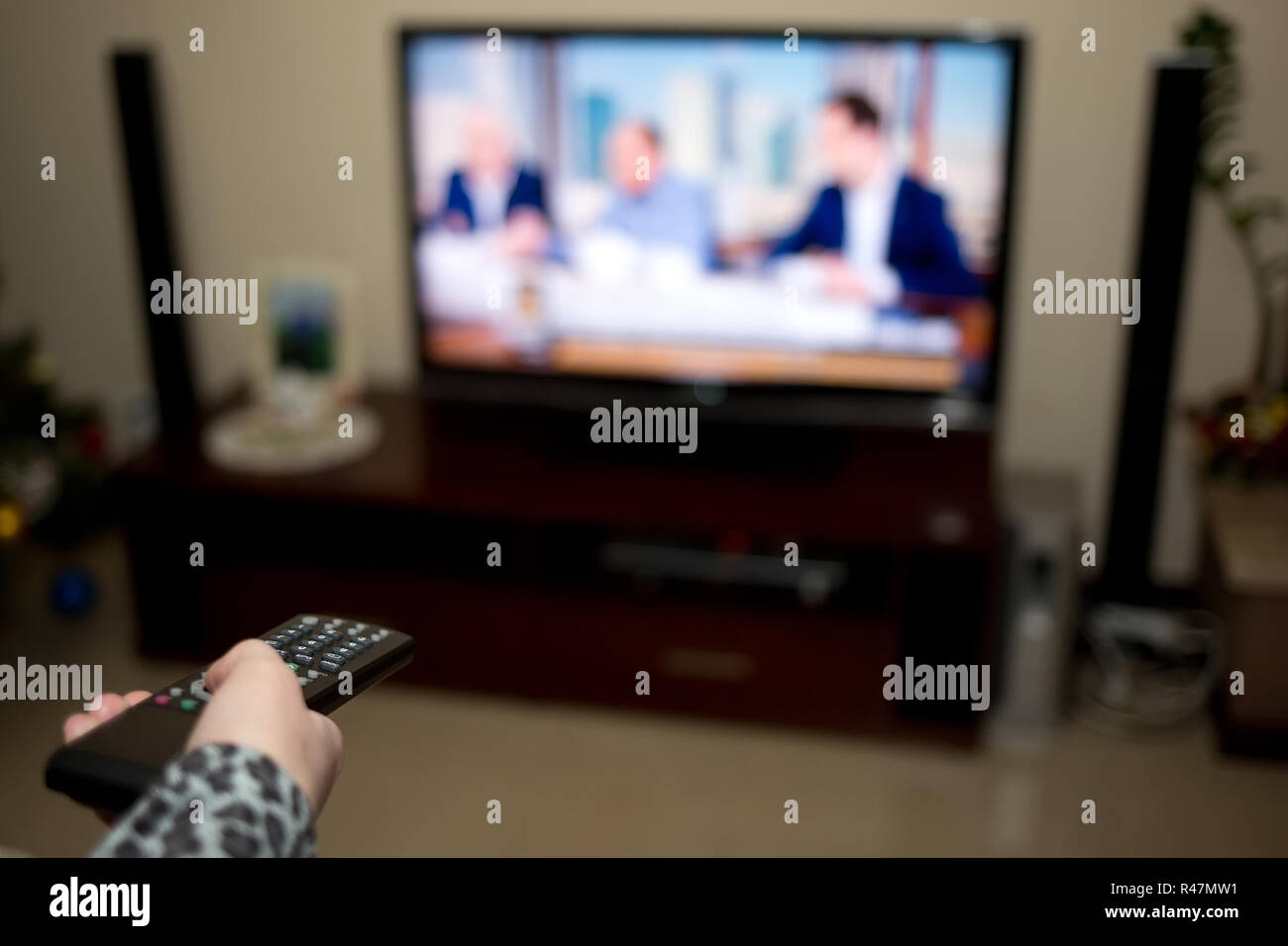 Smart tv hand pressing remote hi-res stock photography and images - Alamy