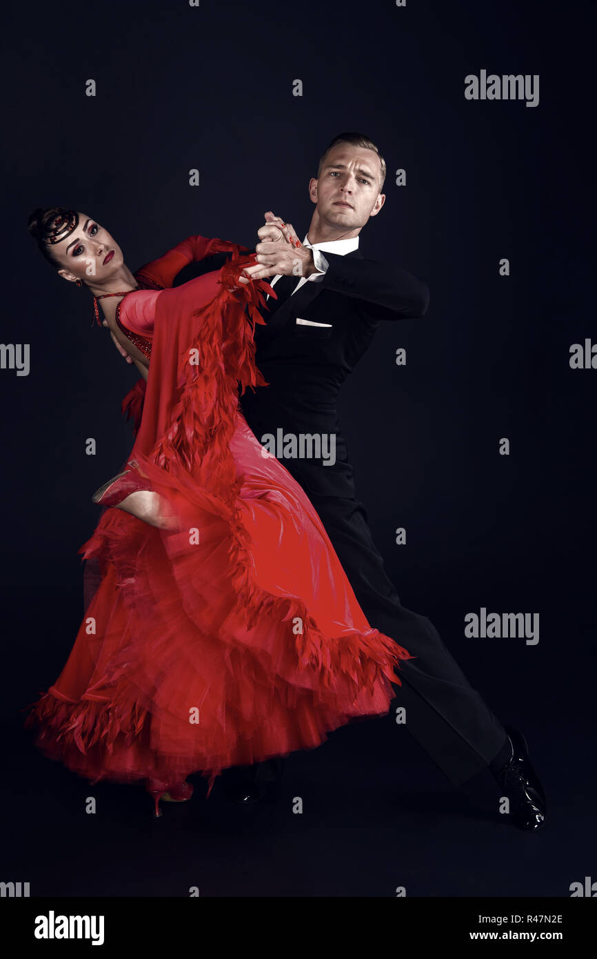 dance ballroom couple in a dance pose on black background. sensual ...