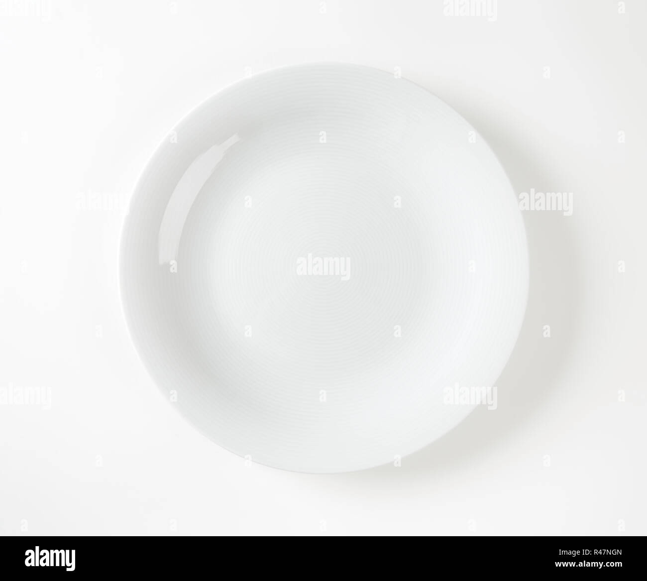 Smooth white dinner plate Stock Photo - Alamy