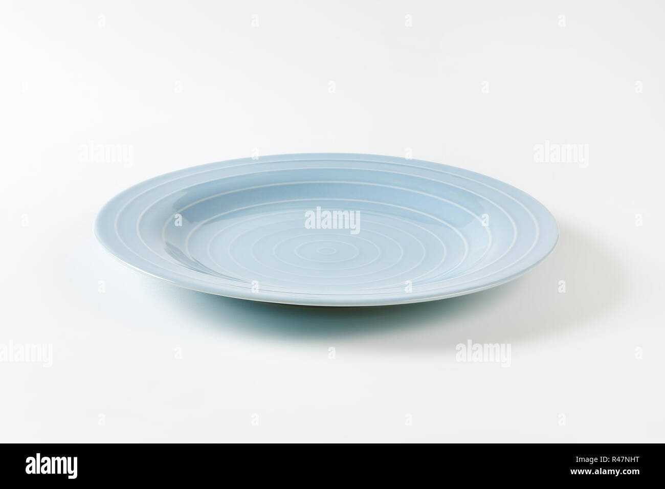 Blue dinner plate Stock Photo - Alamy