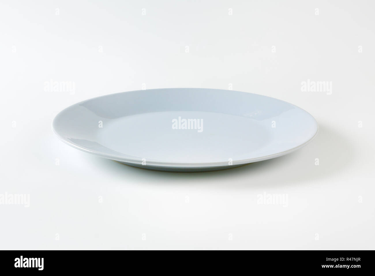 Round gray plate Stock Photo - Alamy