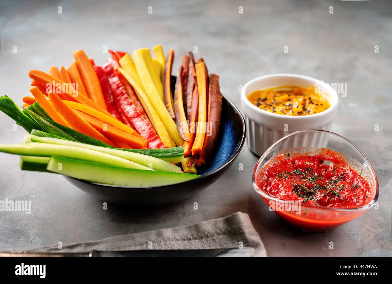 Colorful vegetable sticks in a blue plate Stock Photo - Alamy