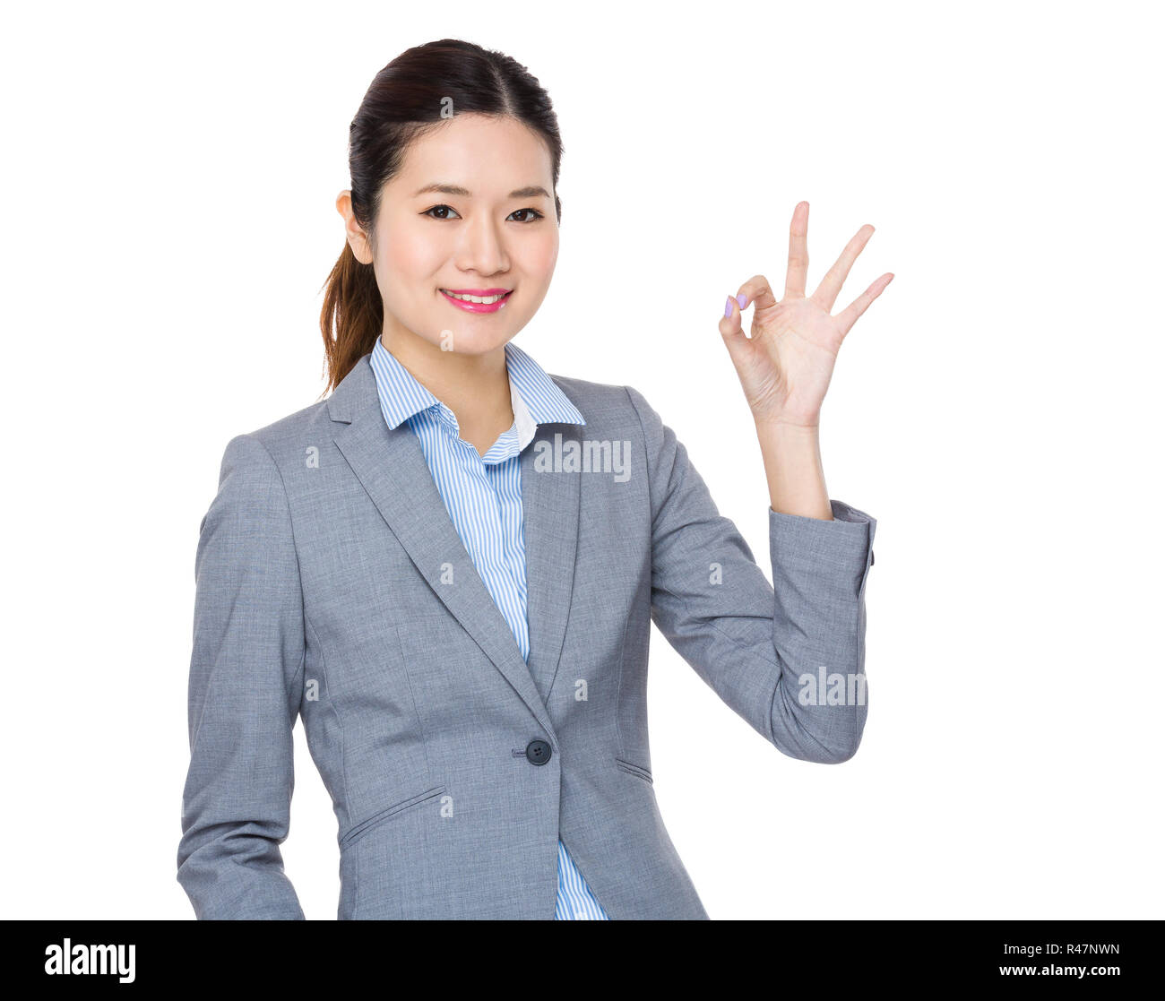 Businesswoman with ok sign gesture Stock Photo - Alamy