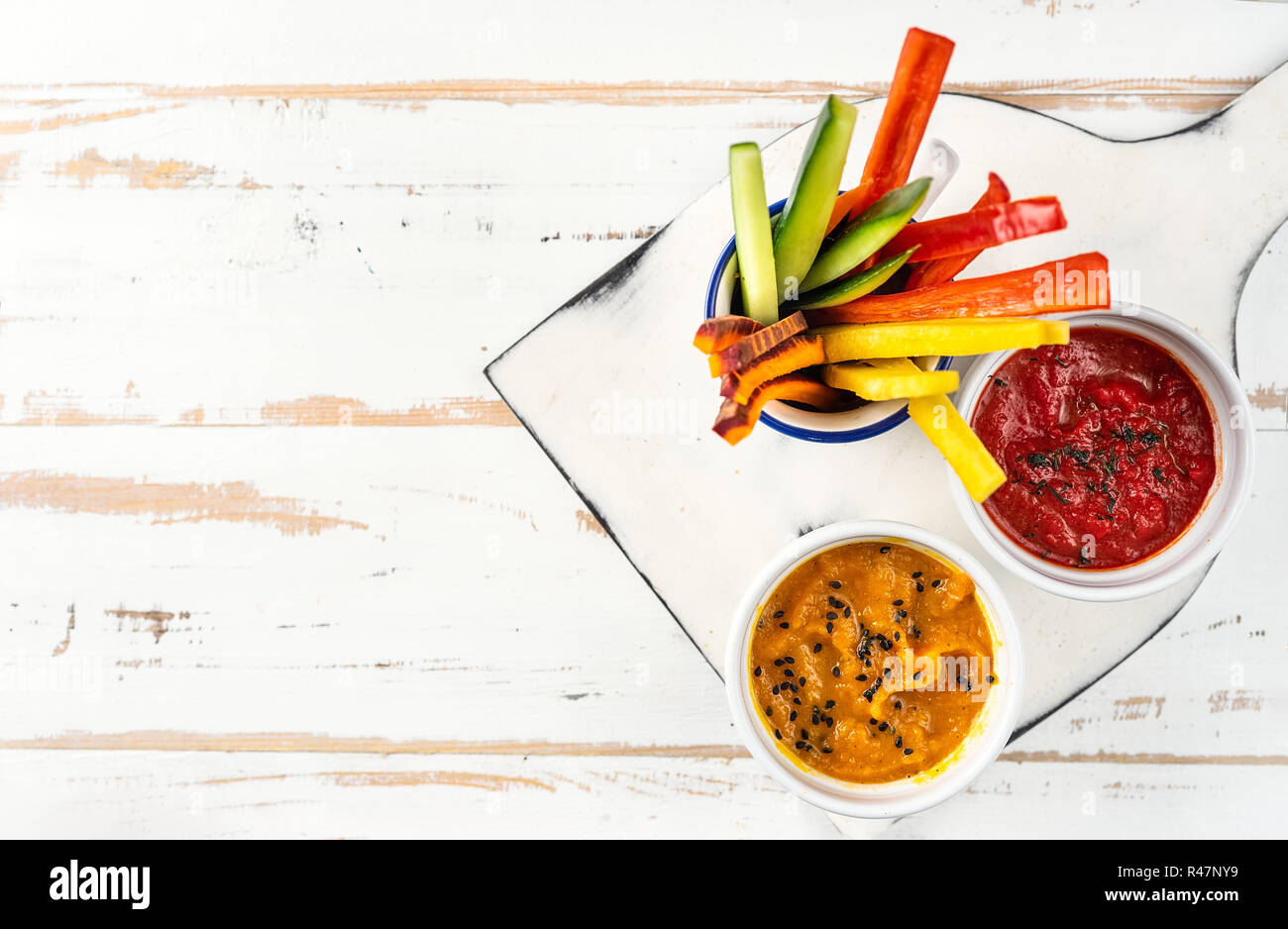 Top view of colorful vegetable sticks on white background Stock Photo ...