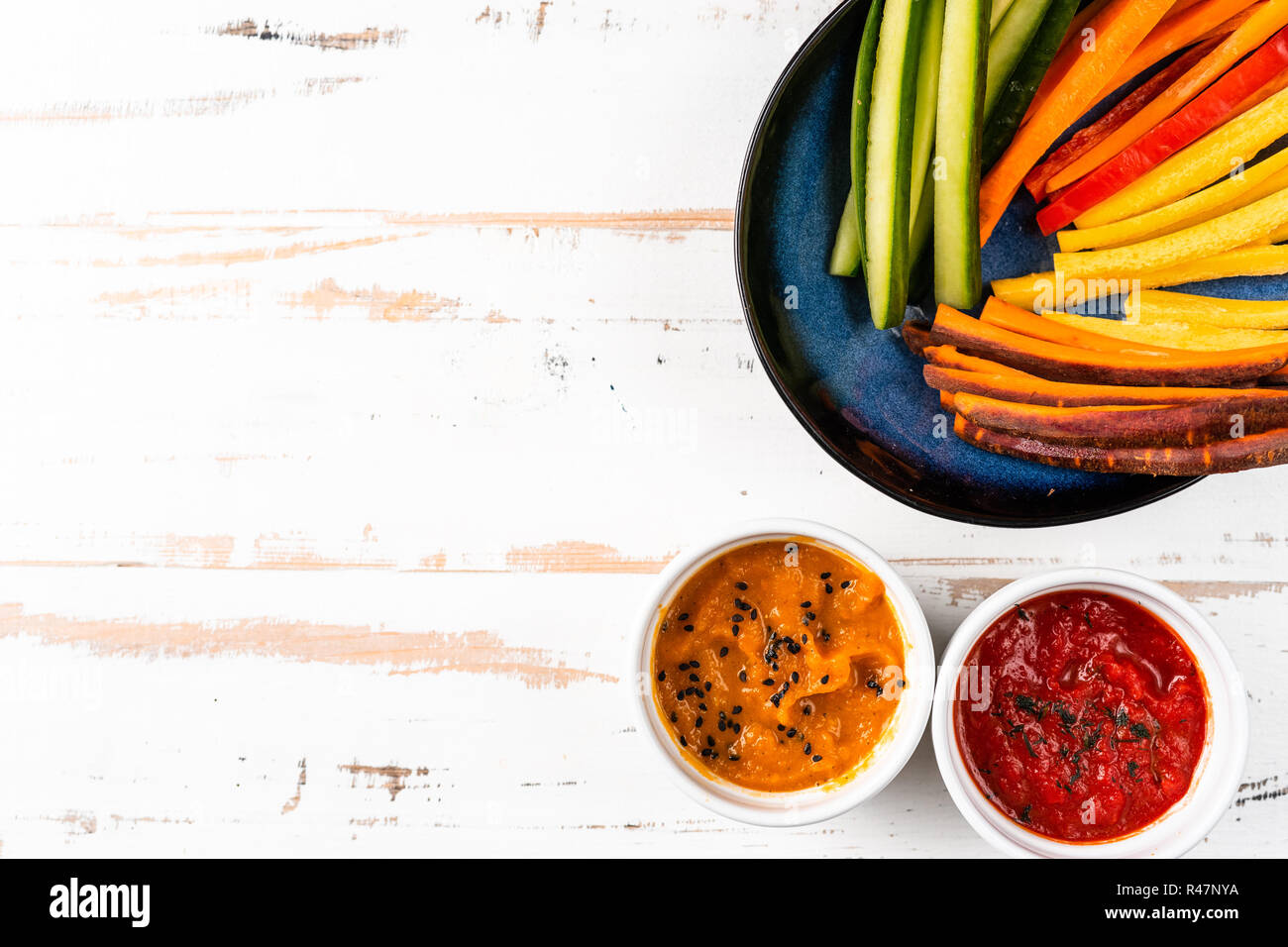 Colorful vegetable sticks in a blue plate Stock Photo - Alamy