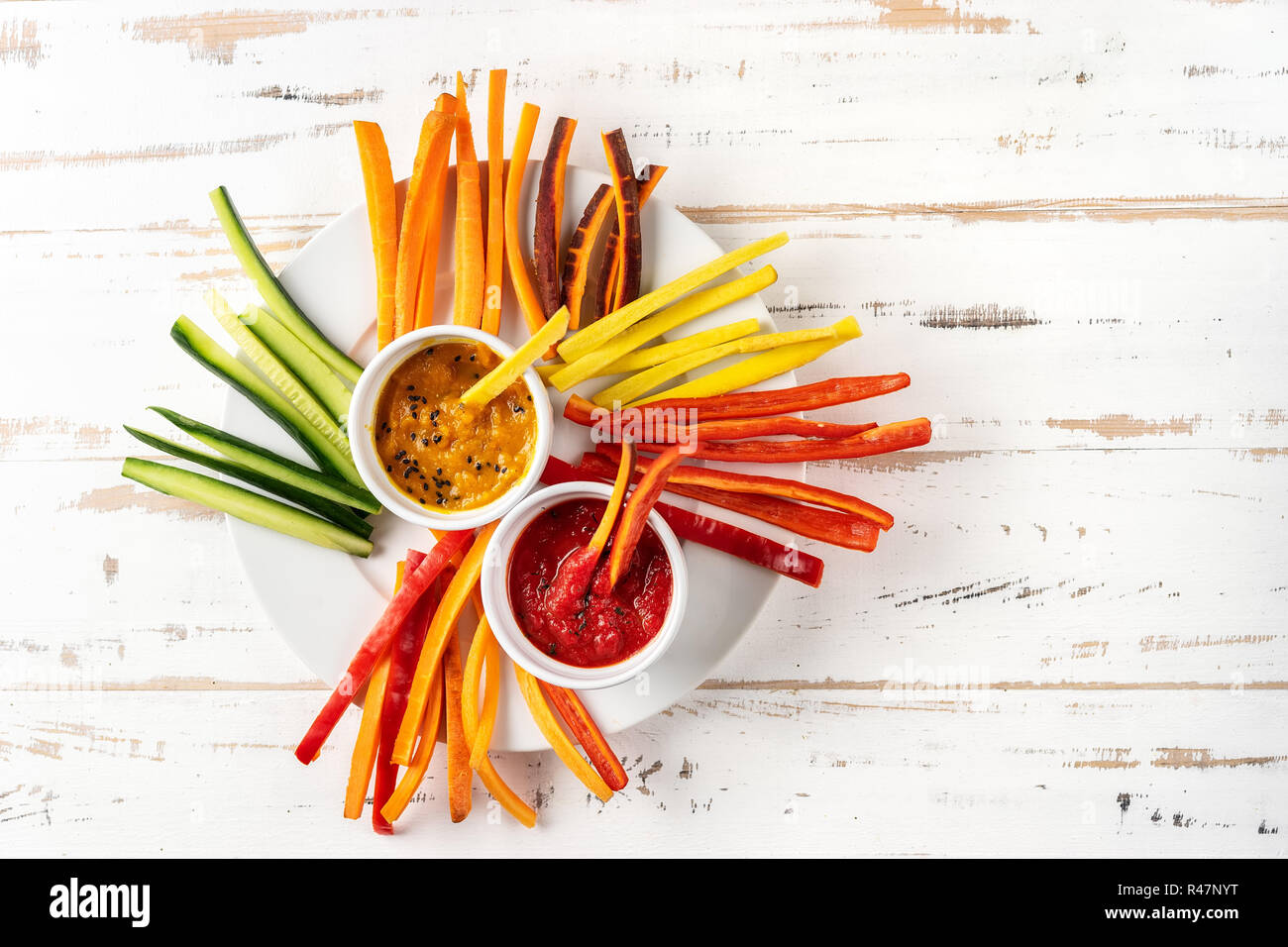 Top view of colorful vegetable sticks on white background Stock Photo ...