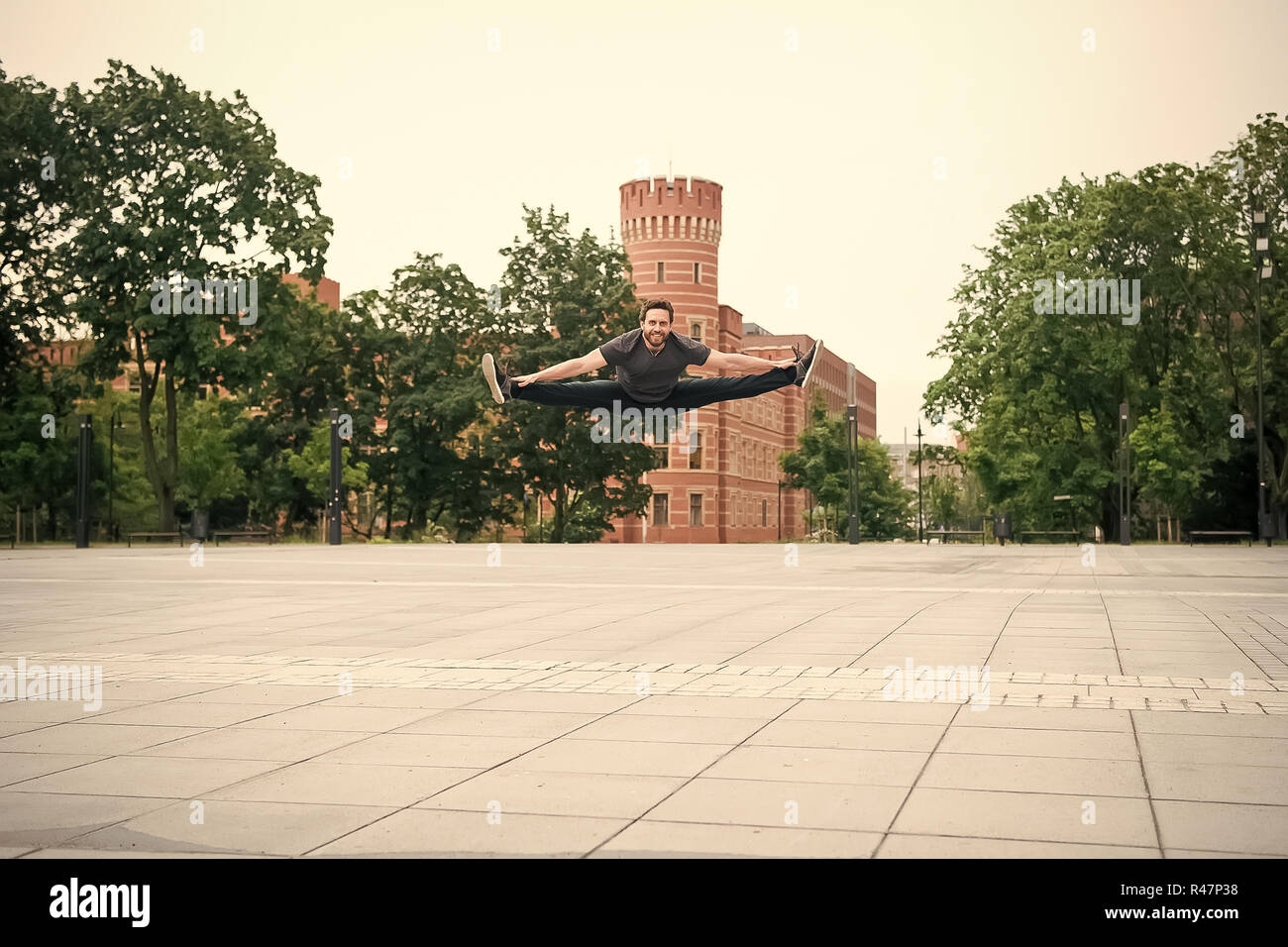 dance, sport, fitness man jumping russian split Stock Photo - Alamy