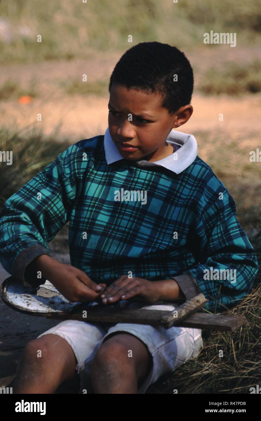 Child playing music instrument africa hi-res stock photography and ...