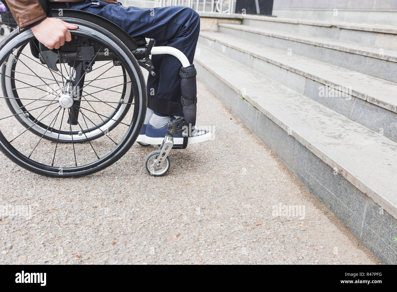 Wheelchair in front stairs hi-res stock photography and images - Alamy