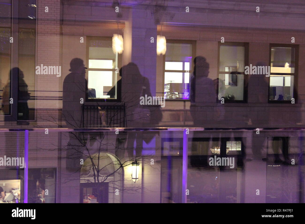 Reflection in window of people standing in line Stock Photo - Alamy
