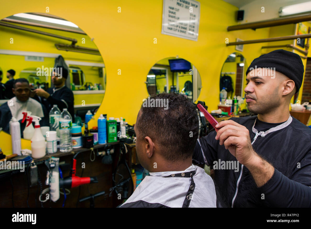 Barber Giving his Client a Haircut, In Barber Shop Stock Photo - Alamy