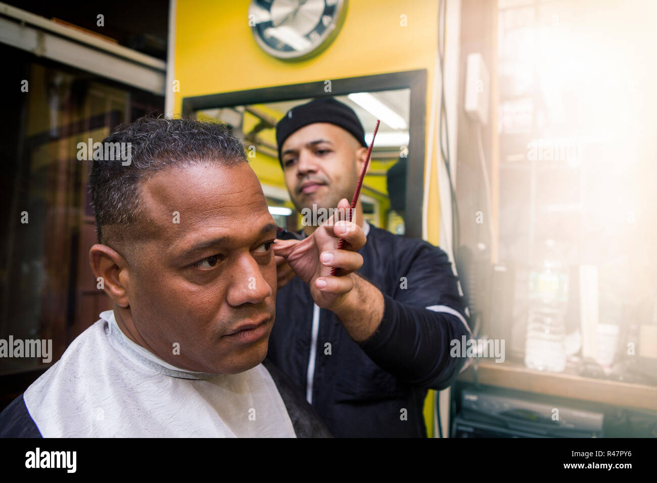 Barber Giving his Client a Haircut, In Barber Shop Stock Photo - Alamy