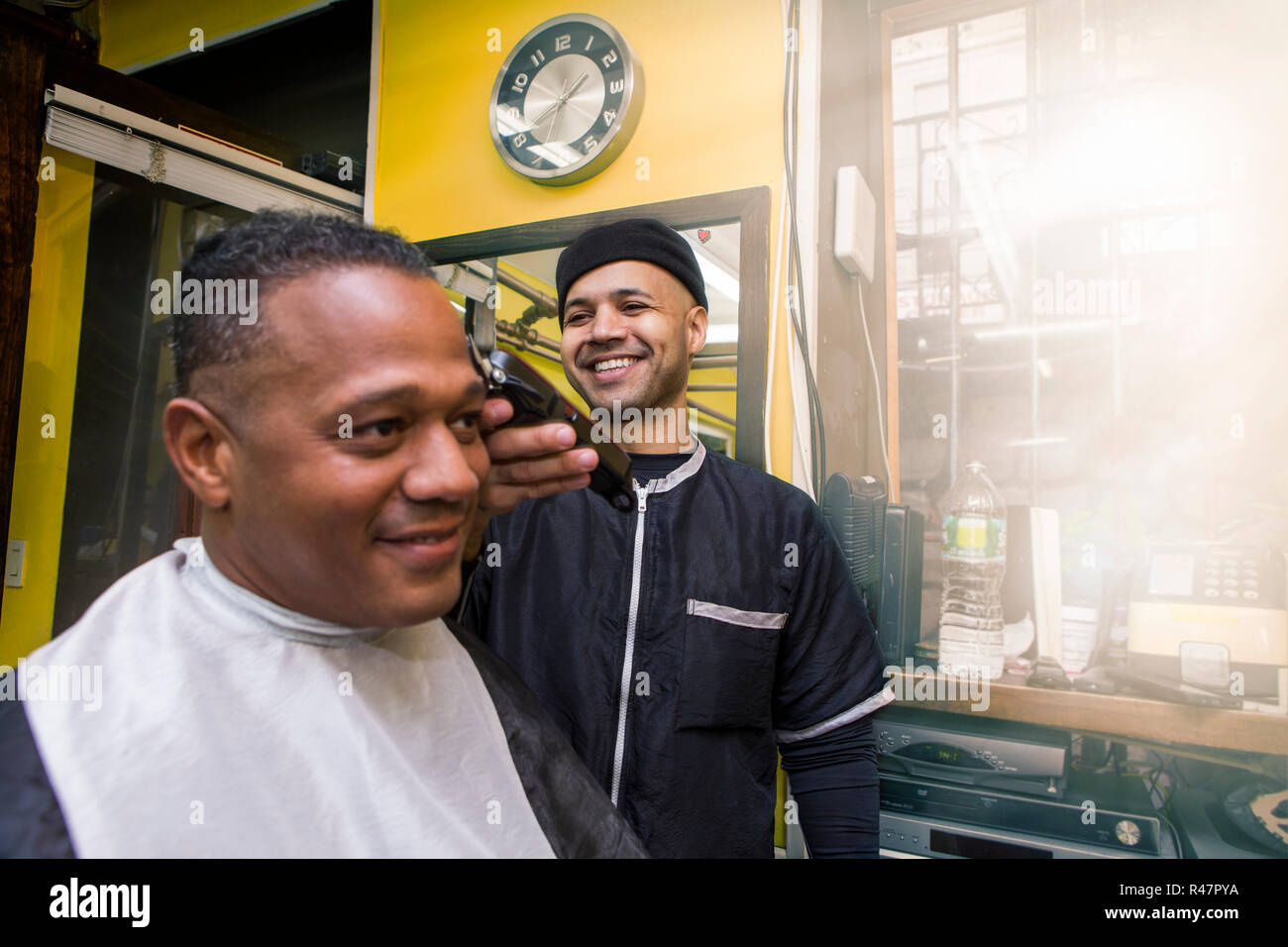 Barber Giving his Client a Haircut, In Barber Shop Stock Photo - Alamy