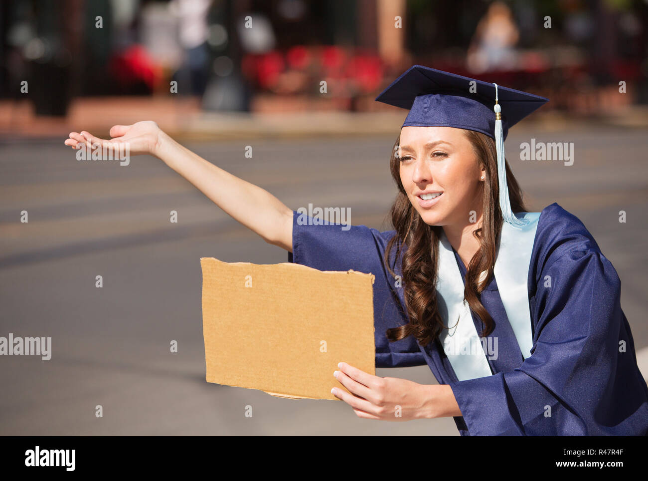 Graduate with Cardboard Sign Stock Photo - Alamy