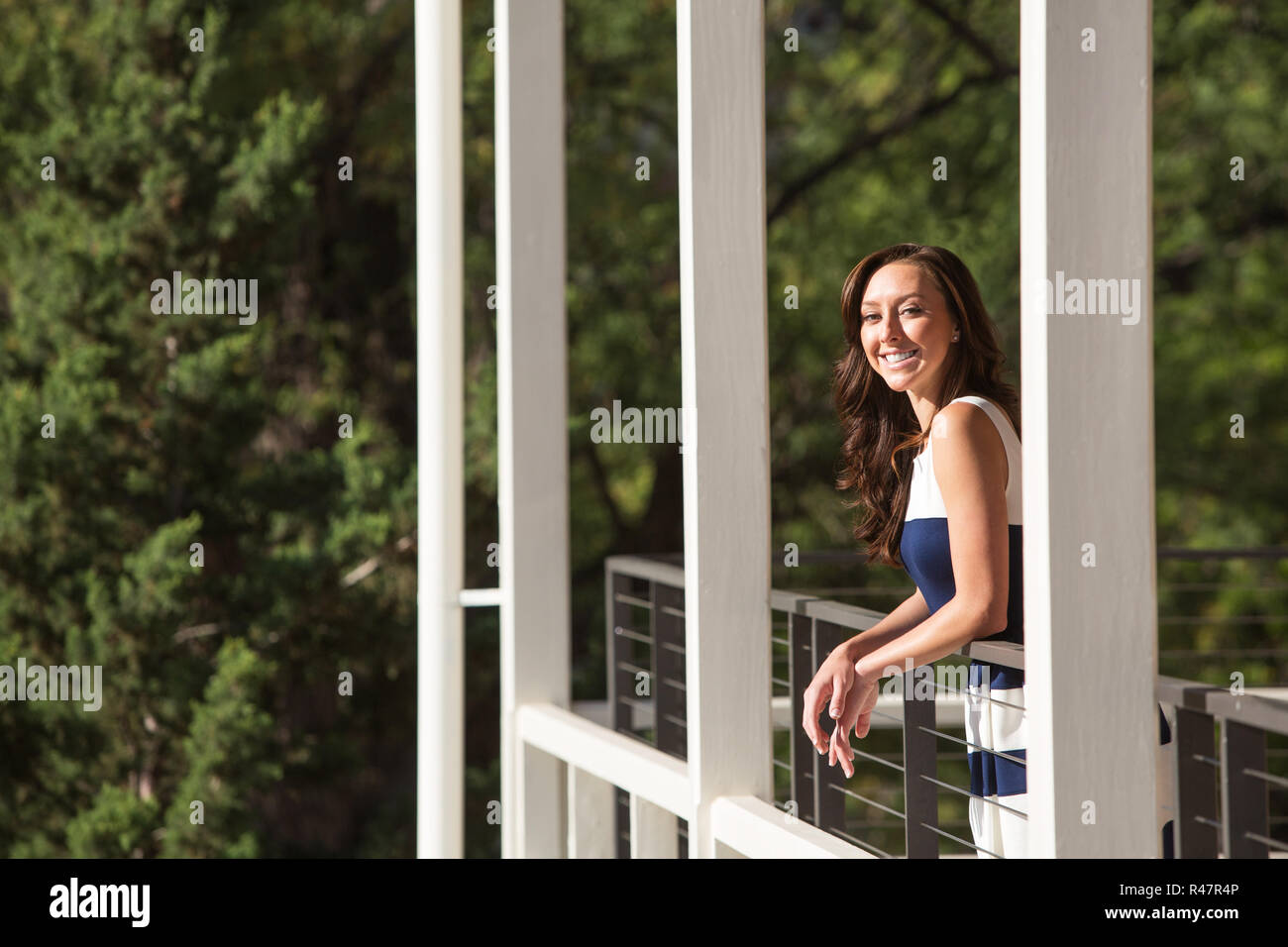 Beautiful Woman On Balcony Stock Photo - Alamy