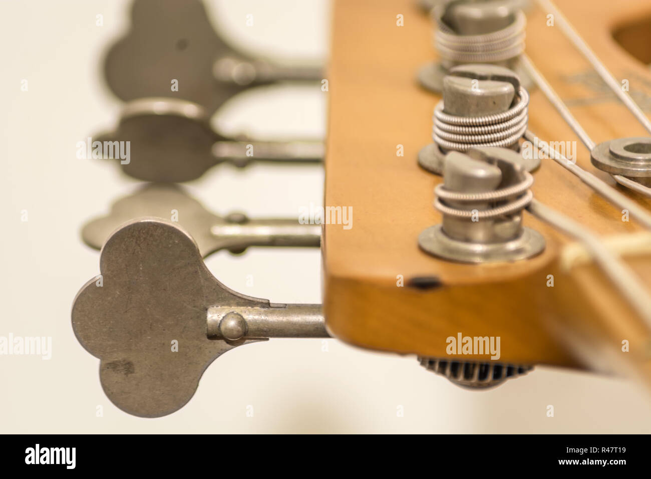 Electric bass tuning heads Stock Photo - Alamy
