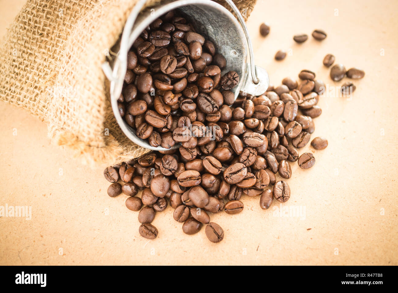 Coffee roasted bean in the bucket on wooden background Stock Photo - Alamy