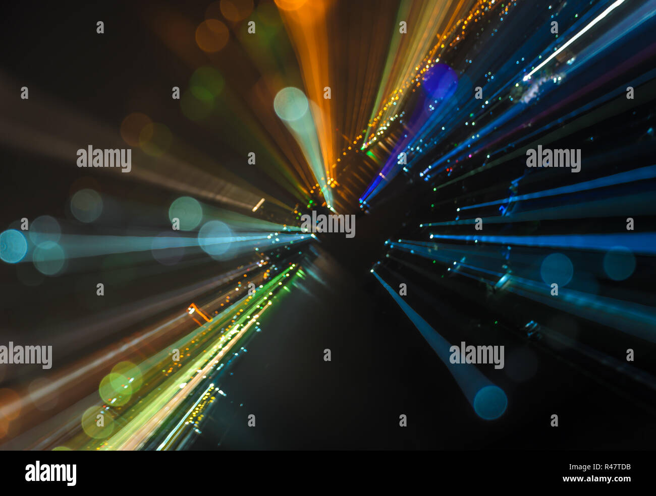 Abstract zoom blur city bokeh lights background Stock Photo - Alamy
