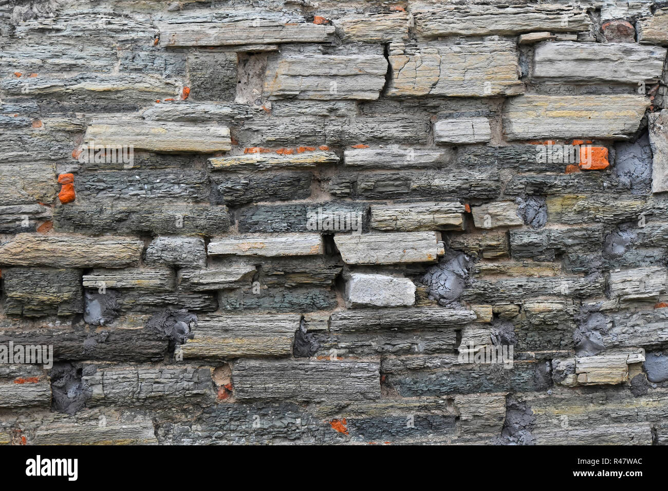 Old stone layered wall Stock Photo - Alamy