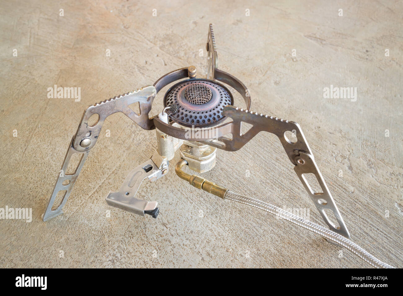 Vintage camping gas stove on grunge floor Stock Photo - Alamy