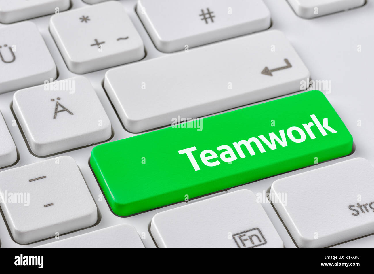 keyboard with color key - teamwork Stock Photo - Alamy