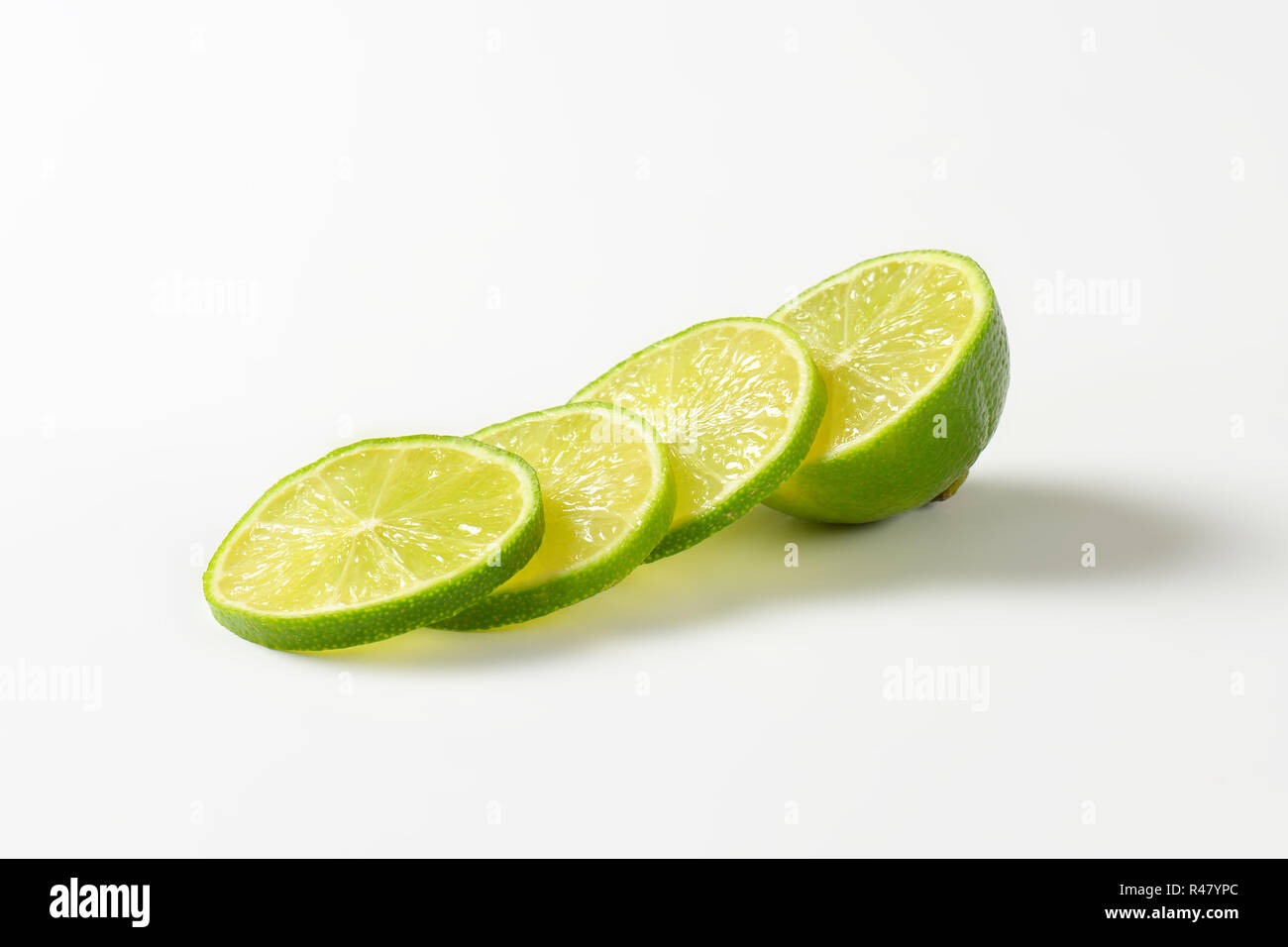 Fresh lime fruit slices Stock Photo - Alamy