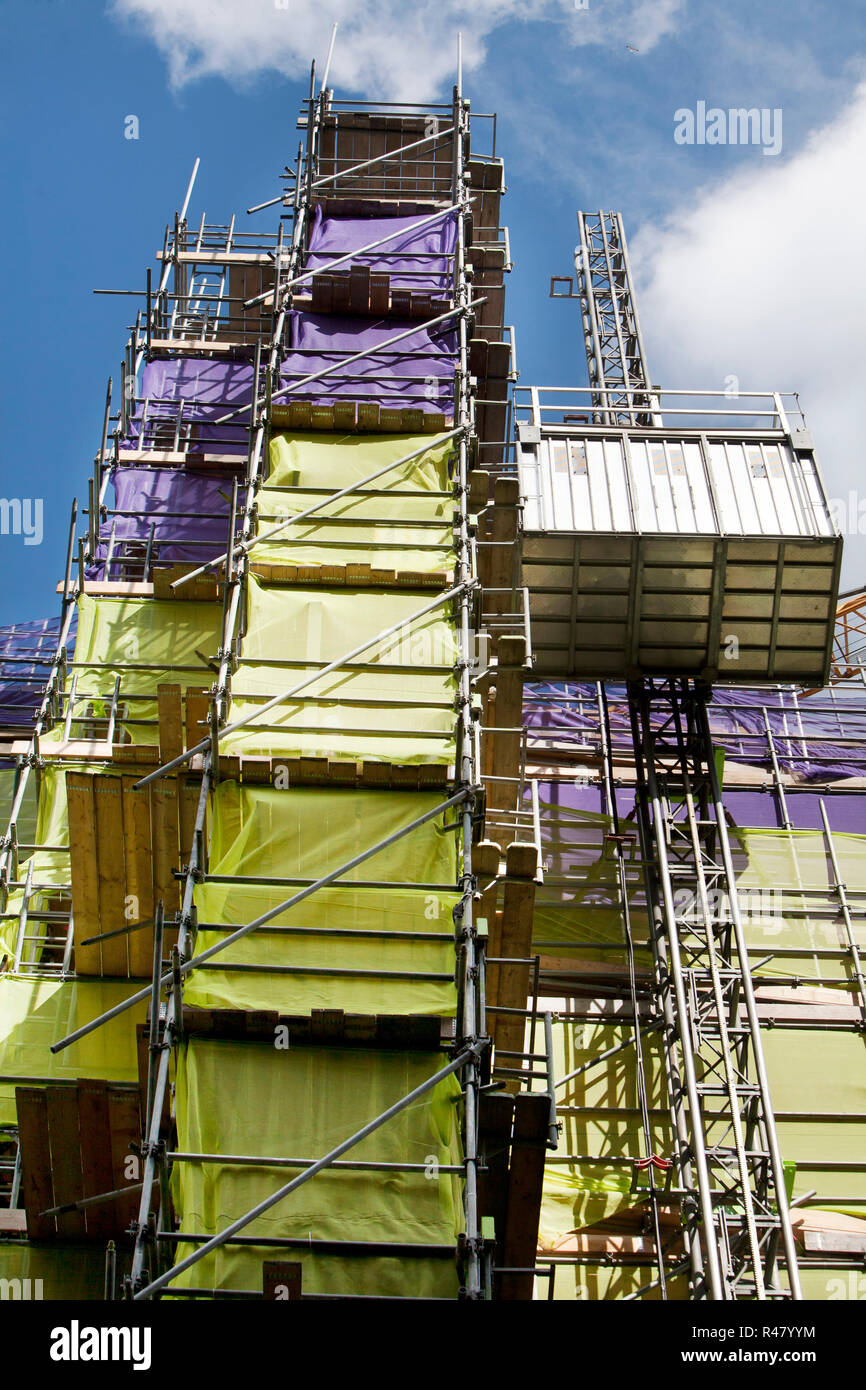 Scaffolding with protection nets on a construction site Stock Photo - Alamy