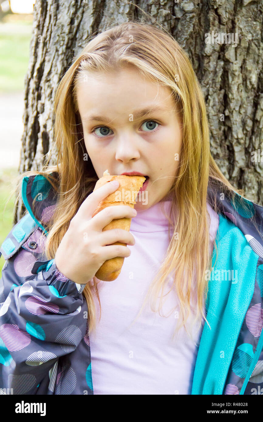 Eating cute girl Stock Photo - Alamy