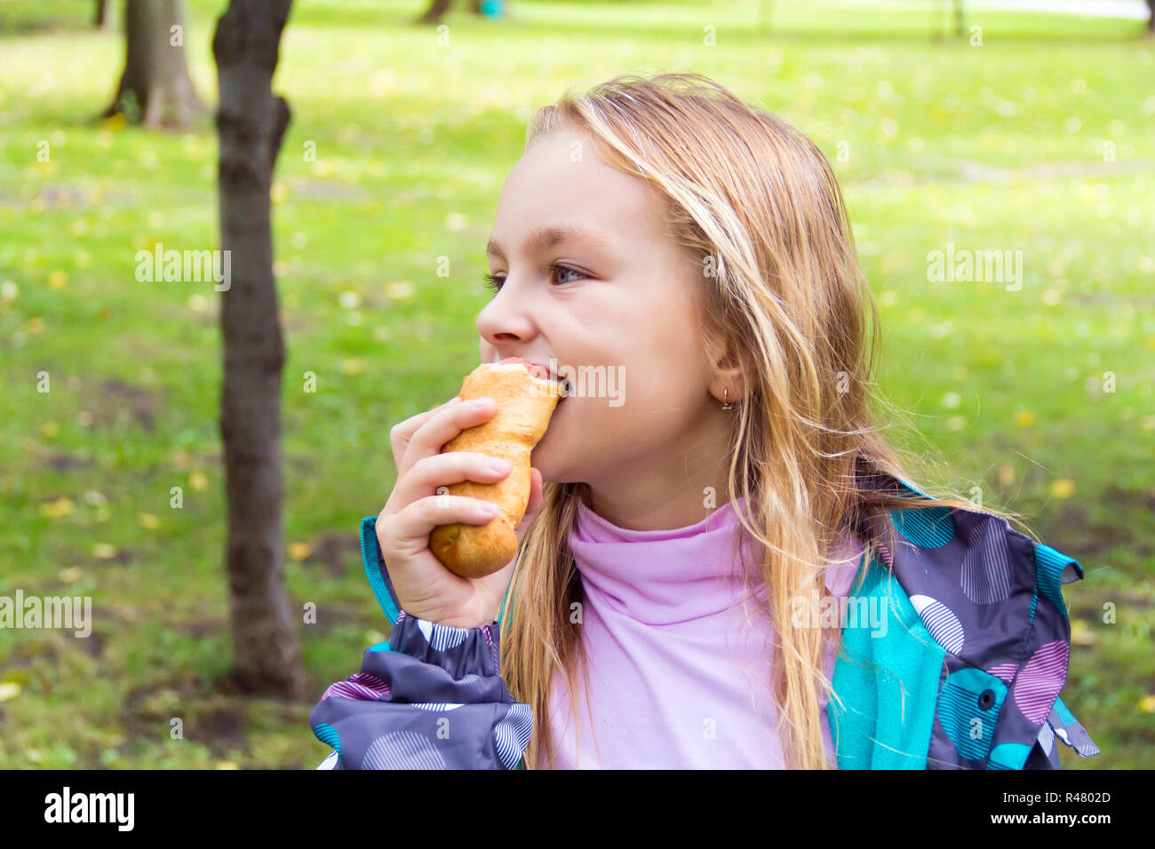 Eating cute girl Stock Photo - Alamy