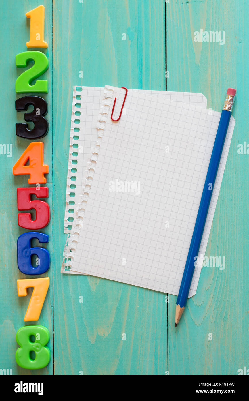 Color numbers and sheet of white paper Stock Photo - Alamy