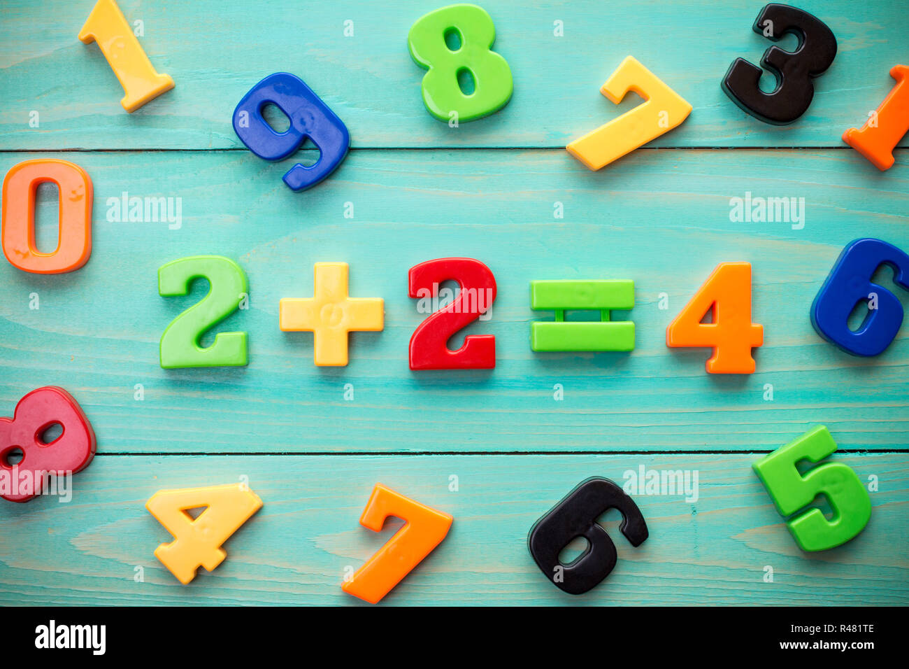 Plastic numbers with math example in a middle Stock Photo - Alamy