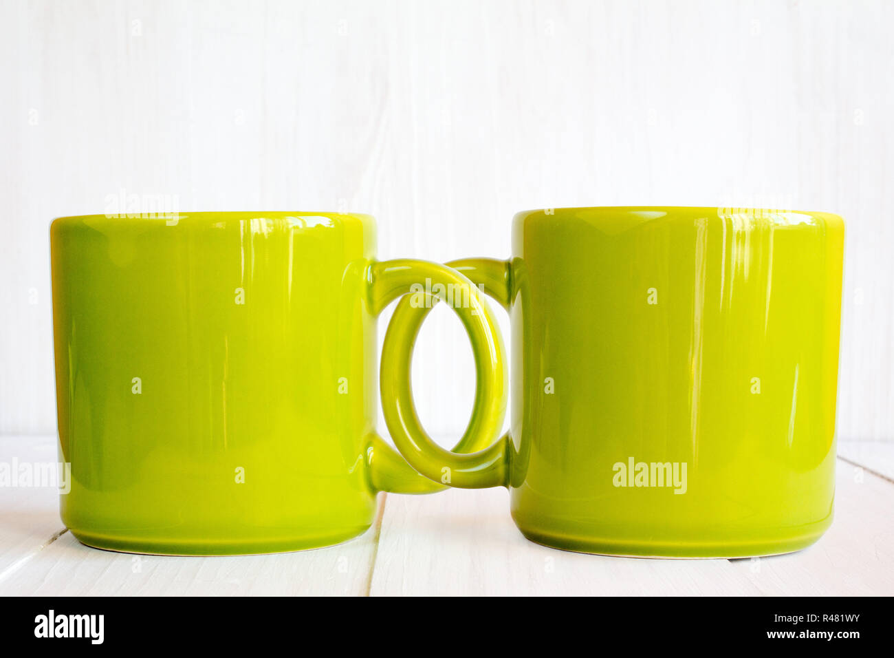 Two coupled coffee mugs Stock Photo - Alamy