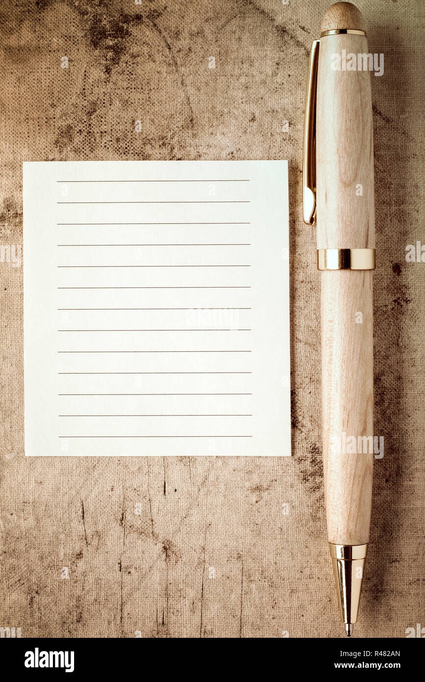 Wooden pen and empty paper note for your text Stock Photo - Alamy