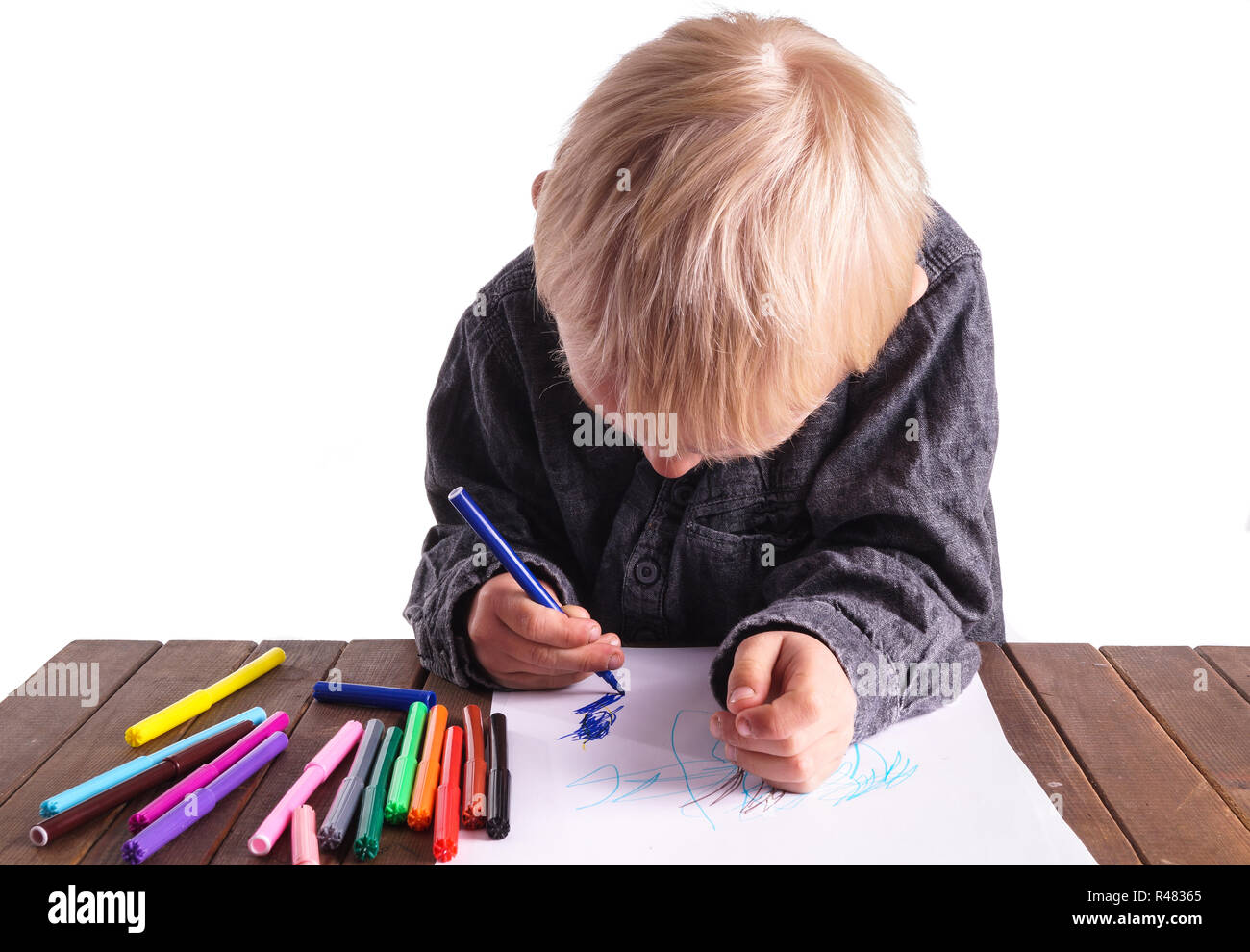 Little boy draws a drawing Stock Photo - Alamy